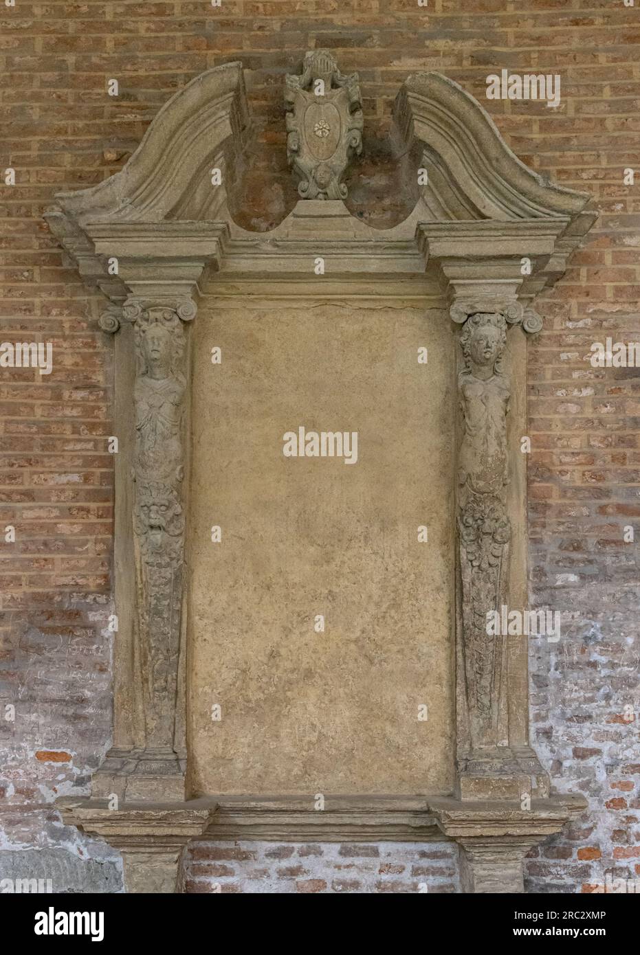 Concrete wall with statue in stucco, brick wall on background Stock ...