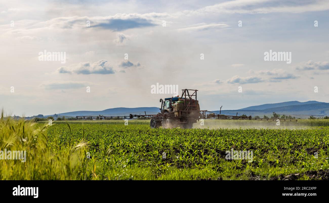 Farming tractor spraying pesticide on hi-res stock photography and images - Alamy