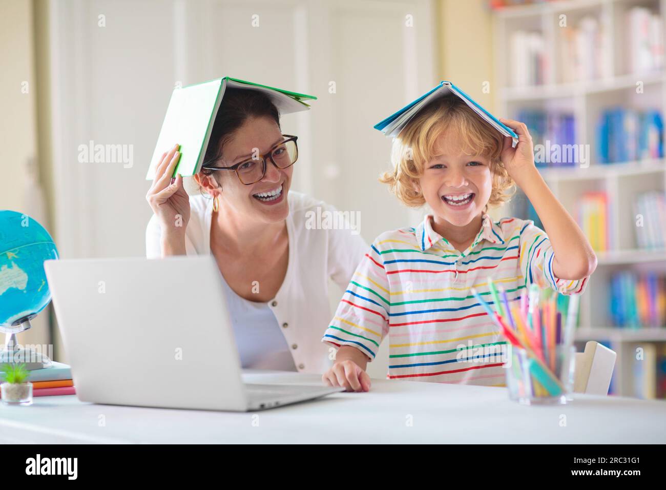 Child doing homework on computer. Online class. Homeschooling and ...