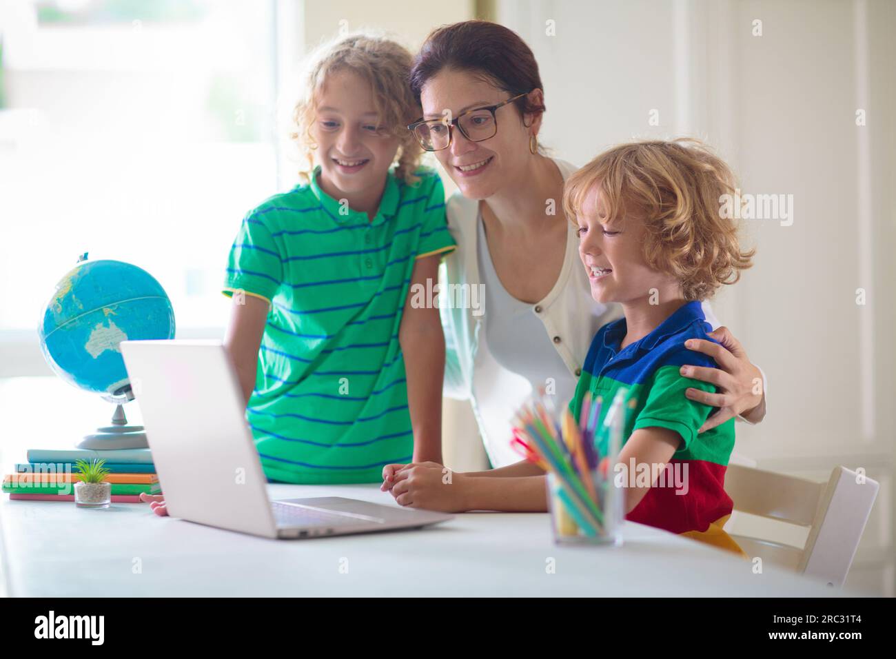 Child doing homework on computer. Online class. Homeschooling and ...