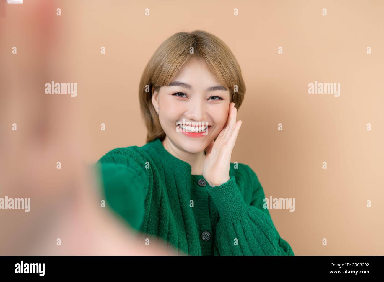 Image of an emotional happy cheery young pretty woman posing isolated ...