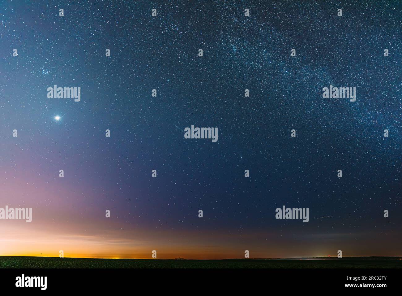 Night Starry Sky With Glowing Stars Above Countryside Field Landscape ...