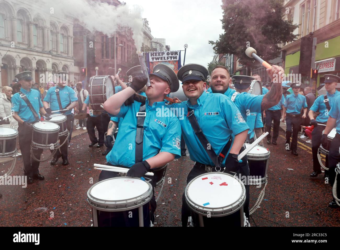 Drummers from the Rathcoole Protestant Flute Band with a smoke flare at ...