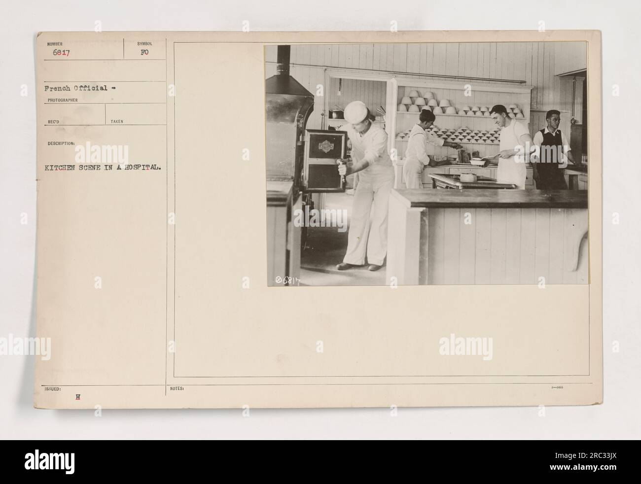 Cooking staff, seen in a kitchen scene at a US Naval Men's Club during ...