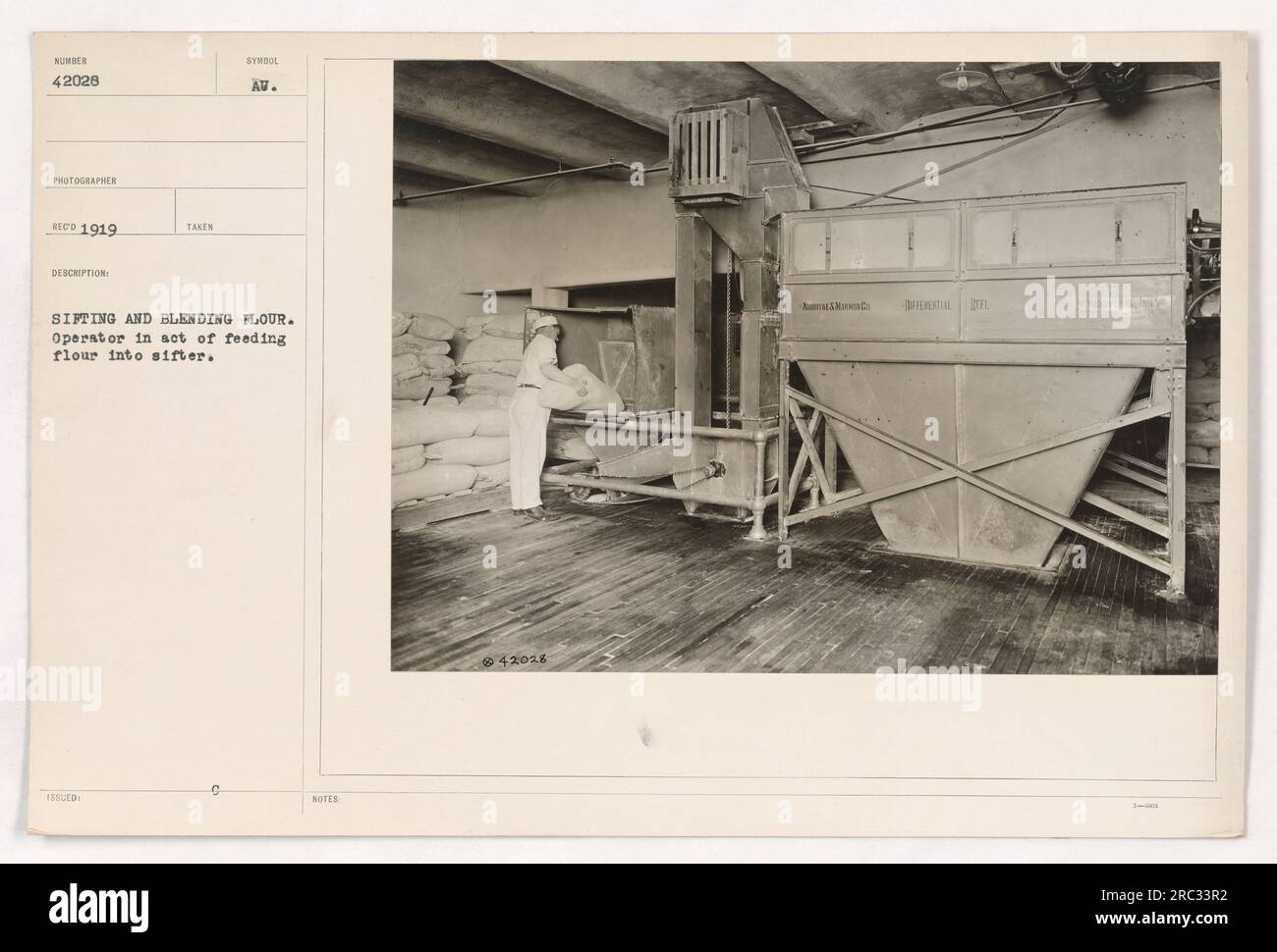 Soldier sifting and blending flour during World War One, 1919. The ...