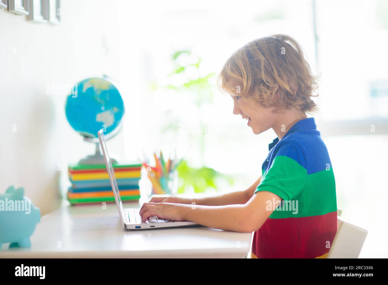 Child doing homework on computer. Online class. Homeschooling and ...