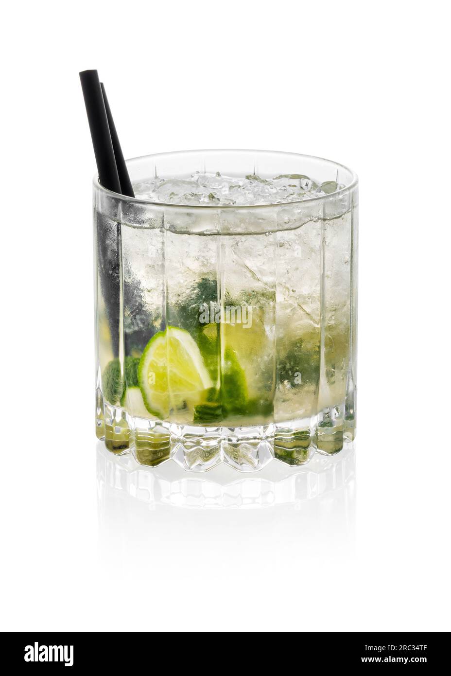 Caipirinha cocktail in glass with ice cubes lime slices and black straws isolated on white ...