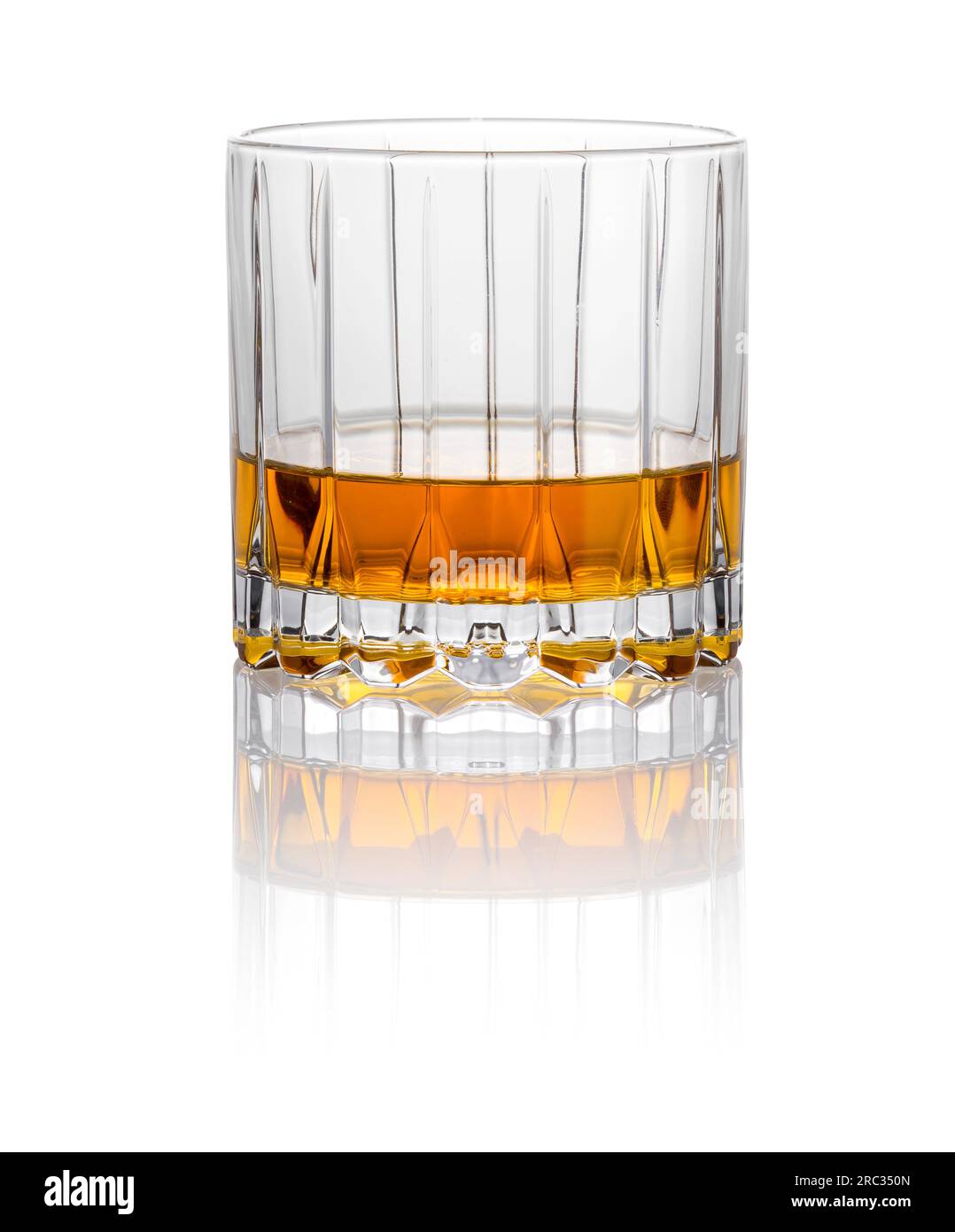 Transparent crystal glass filled with fresh whiskey alcohol isolated on ...