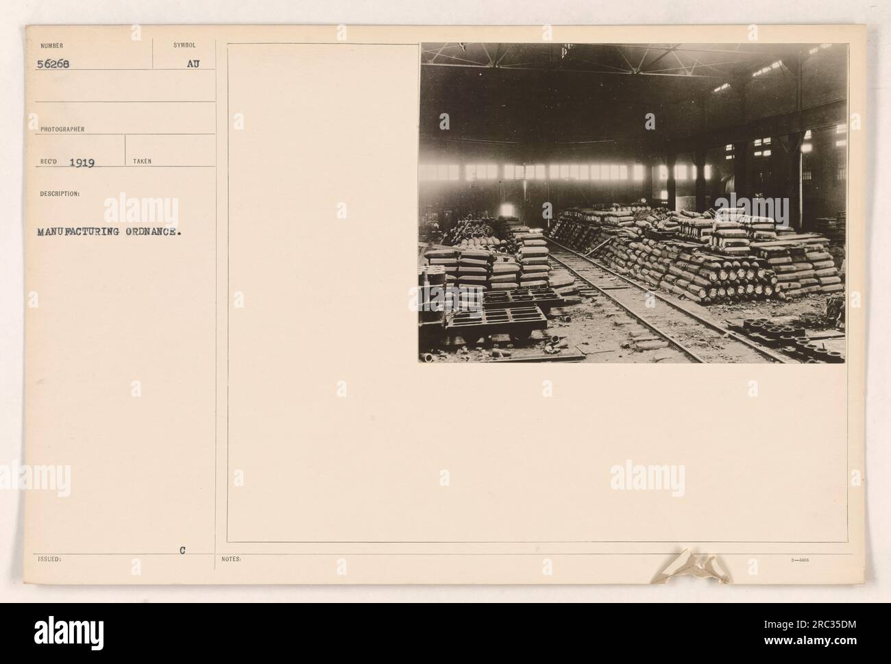 Workers at a manufacturing facility during World War One produce ...