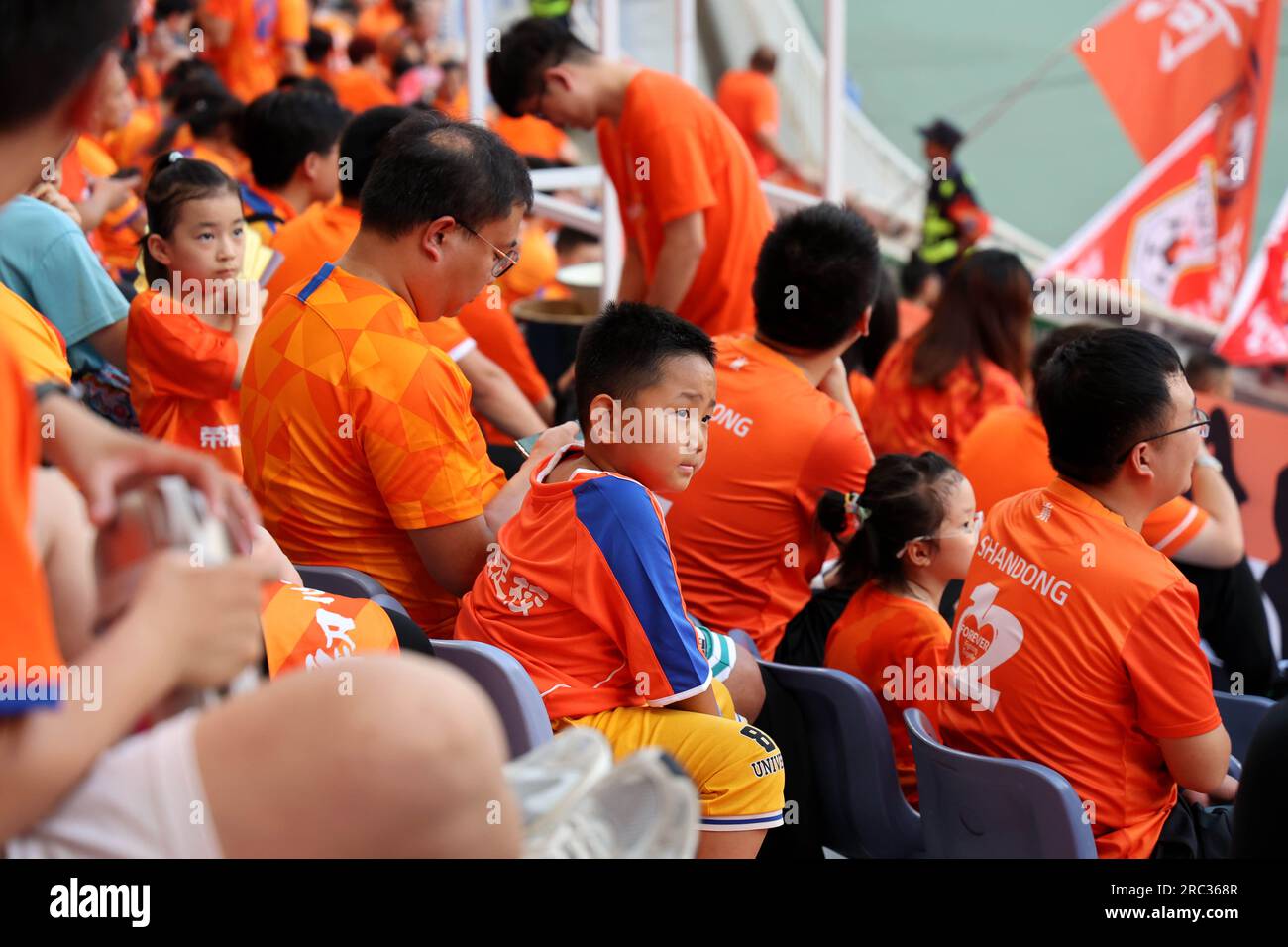 JINAN, CHINA - JULY 11, 2023 - Fans cheer for their favorite team ...