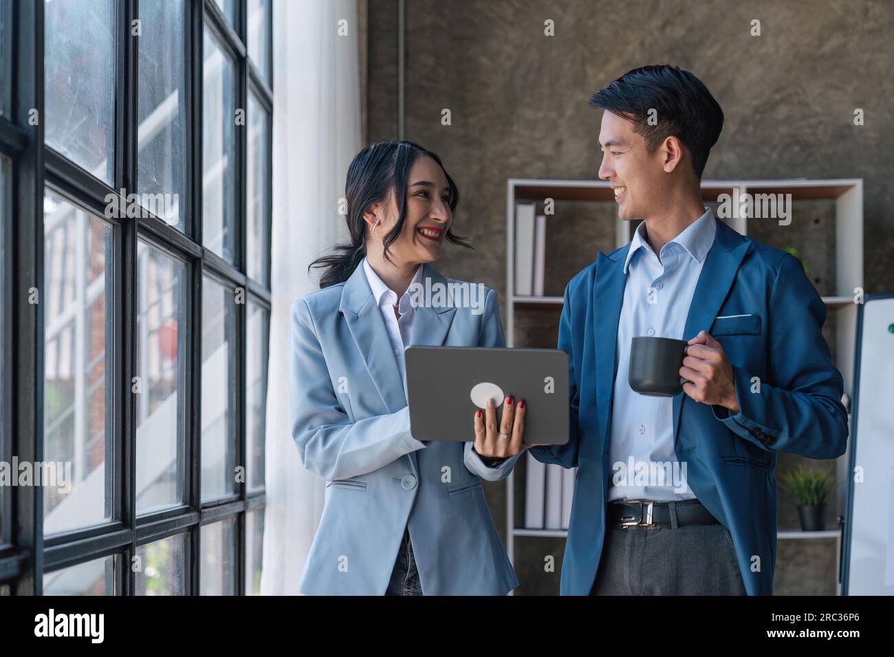 Smart business people working together with tablet while talking in the ...