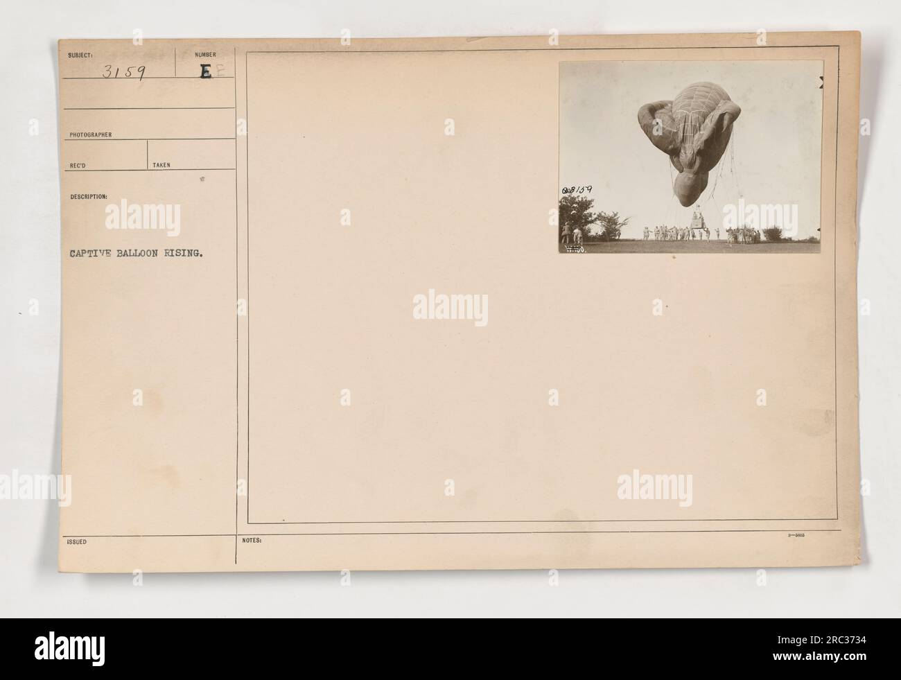 A captive balloon rises into the sky during World War One. This ...