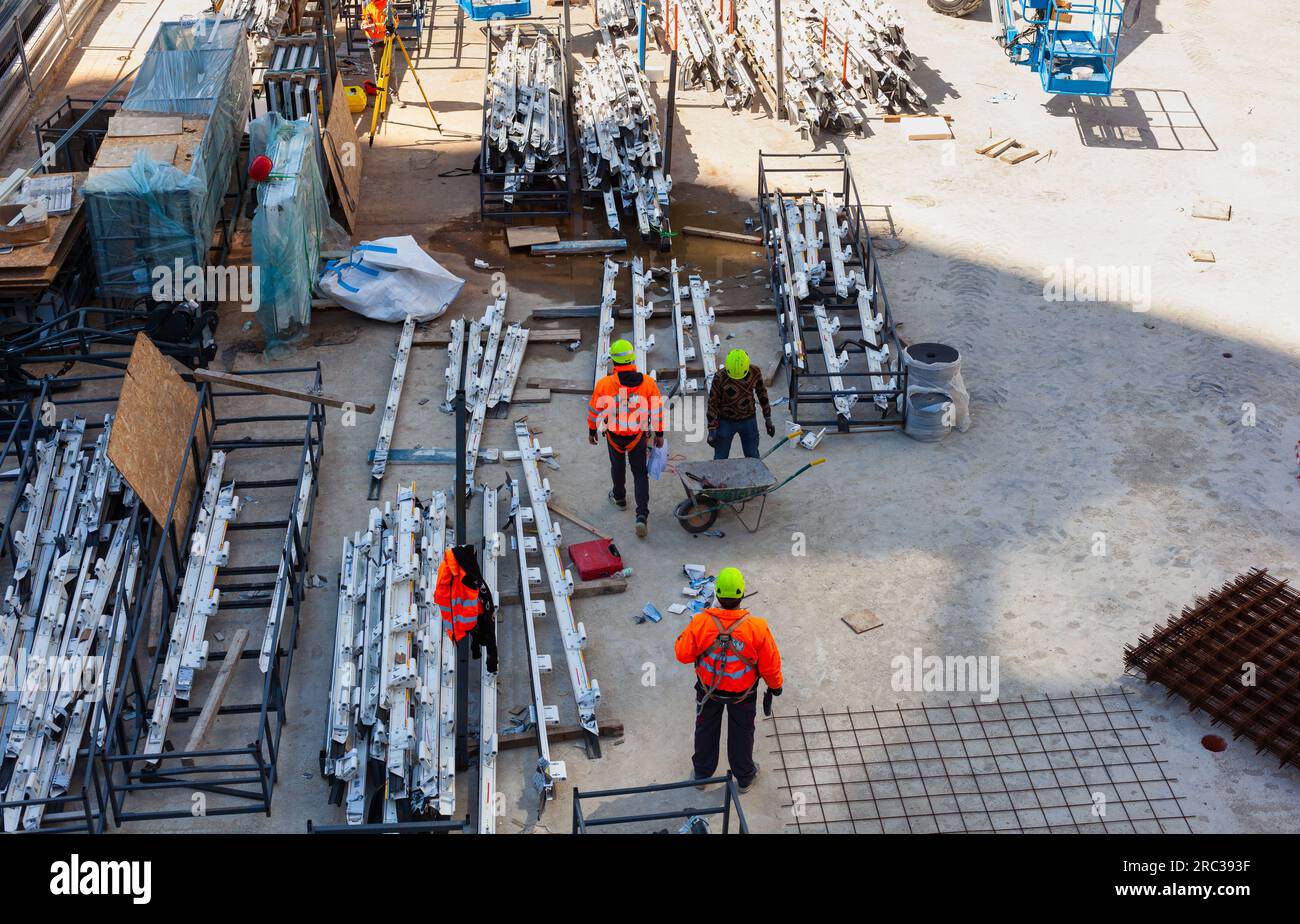 A Group of construction workers on building site of Milan Stock Photo ...