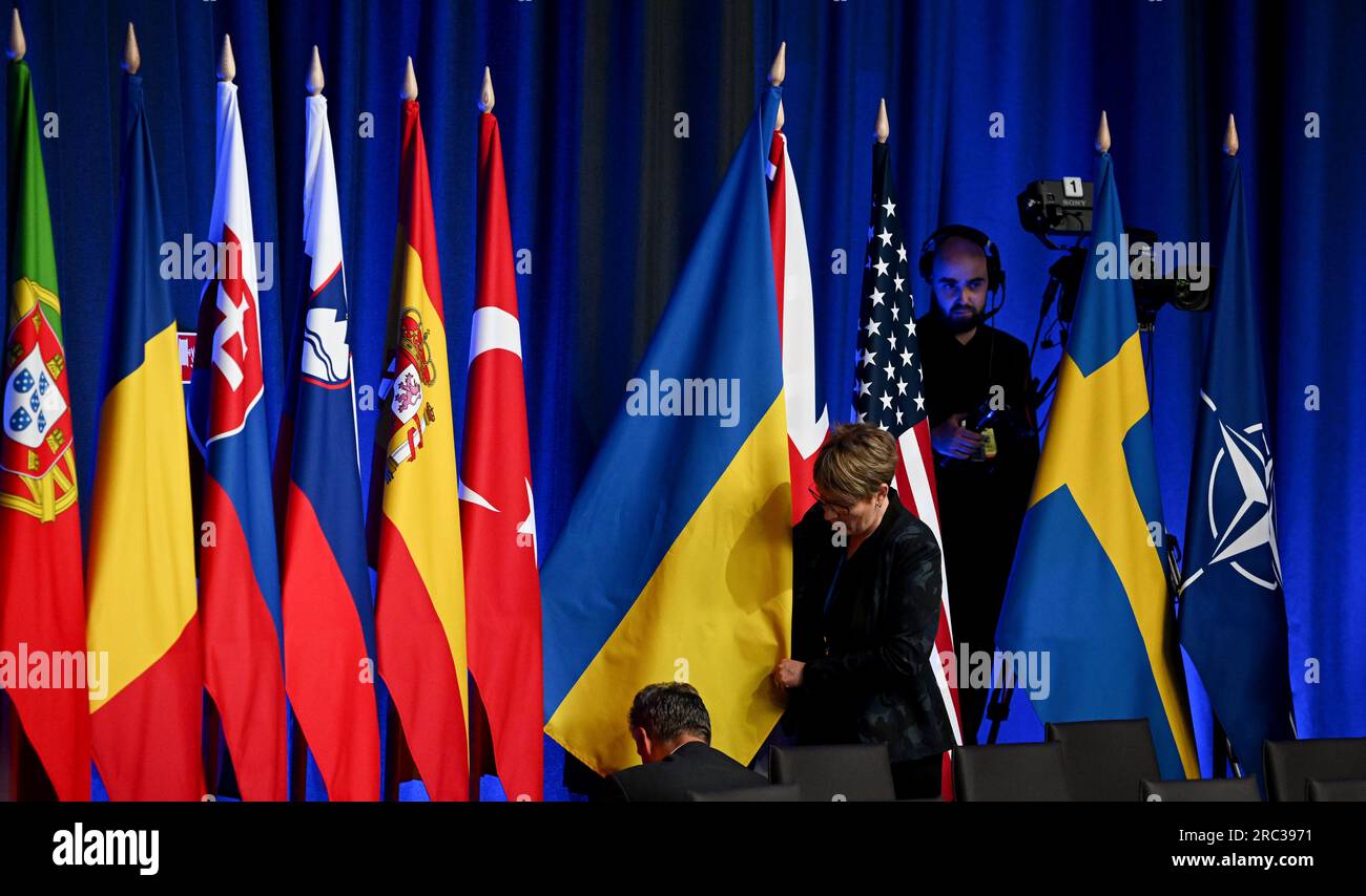 The Ukrainian national flag is placed next to the flags of other member ...