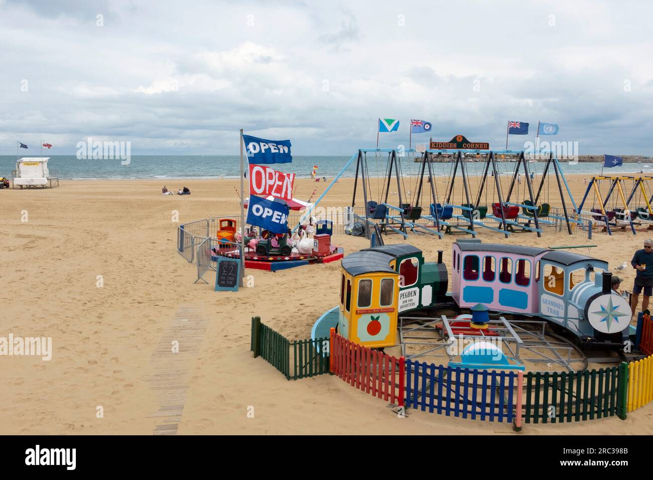 Miniature train and swings on the beach at the seafront, Margate, Kent ...