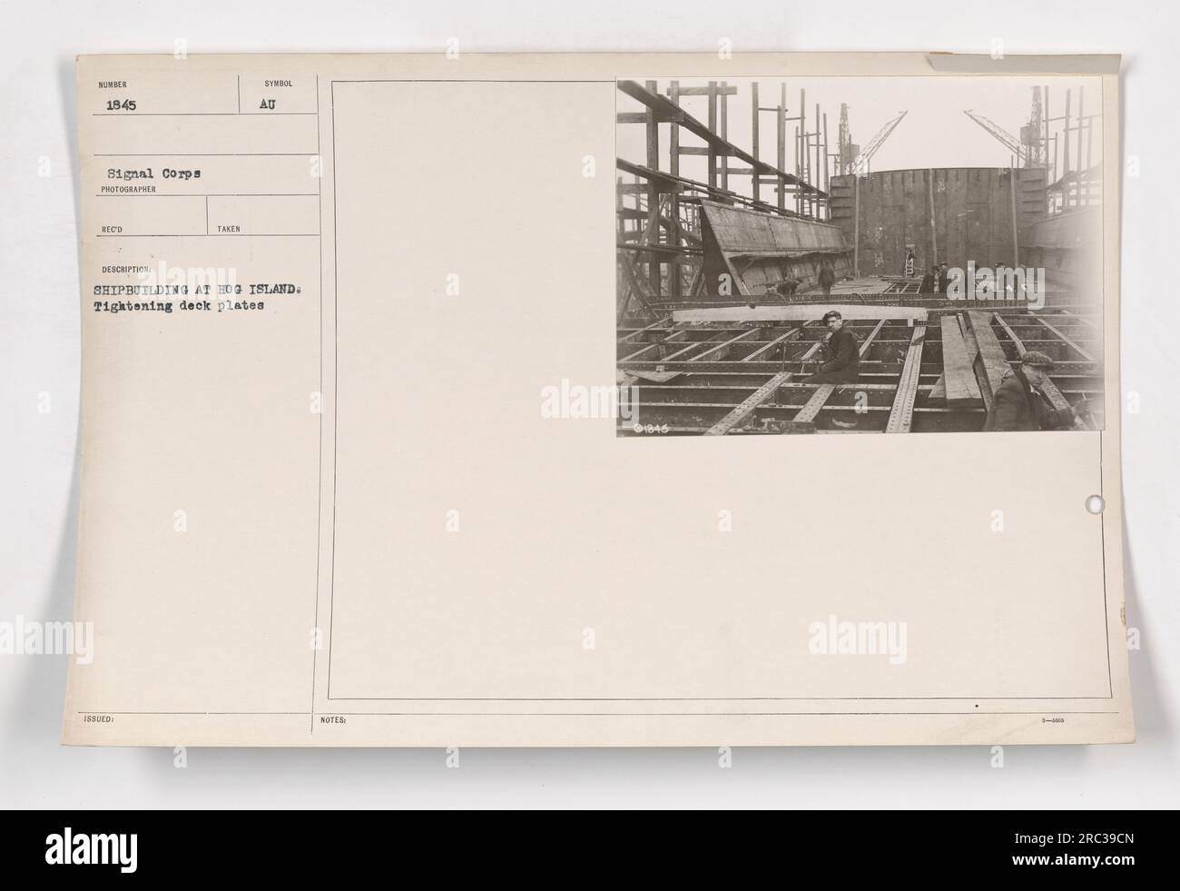 Workers tighten deck plates on a ship being built at Hog Island during ...