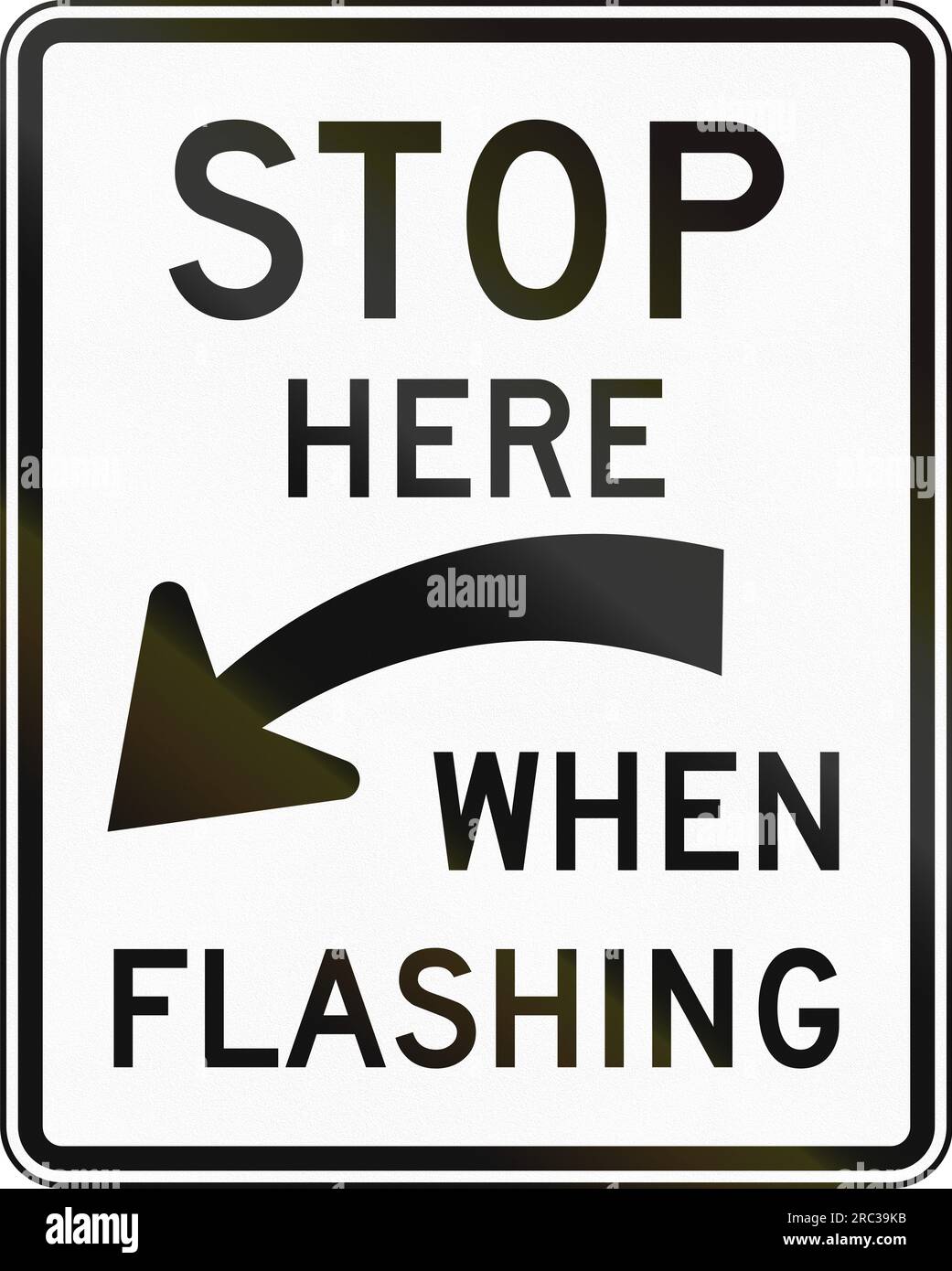 United States traffic sign: Stop here when flashing Stock Photo - Alamy