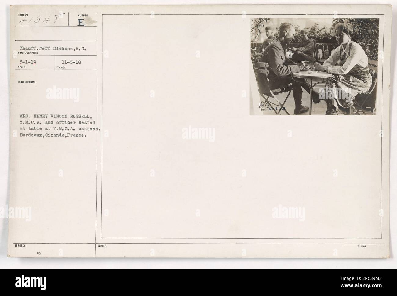 Chauff. Jeff Dickson, S. C. and an officer are seen seated at a table ...