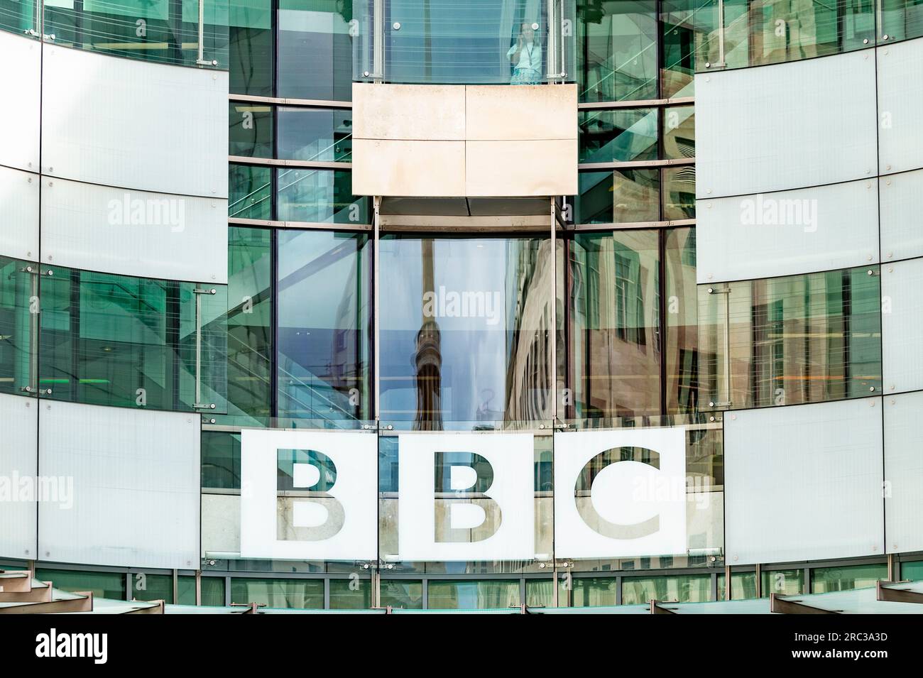 London, UK. 12 July 2023. A staff member looks out from the windows of ...