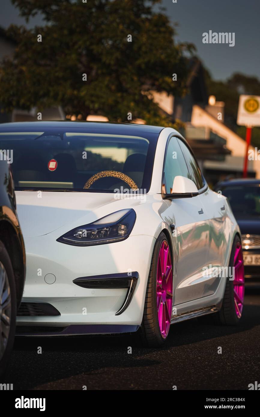 A Tesla with pink wheels looks so fancy Stock Photo - Alamy