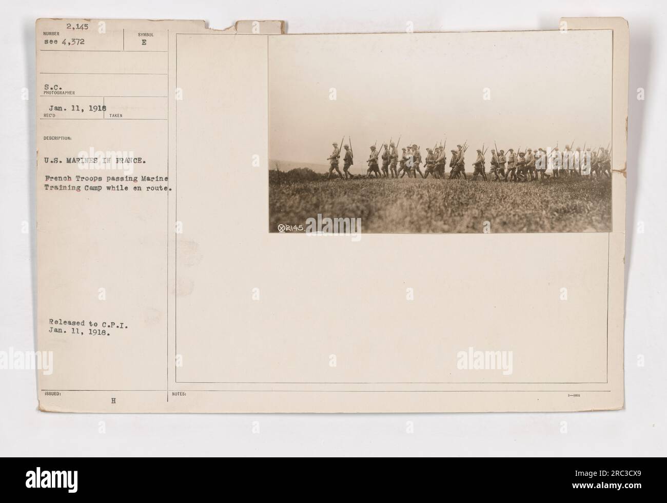 French troops passing a United States Marine training camp in France ...