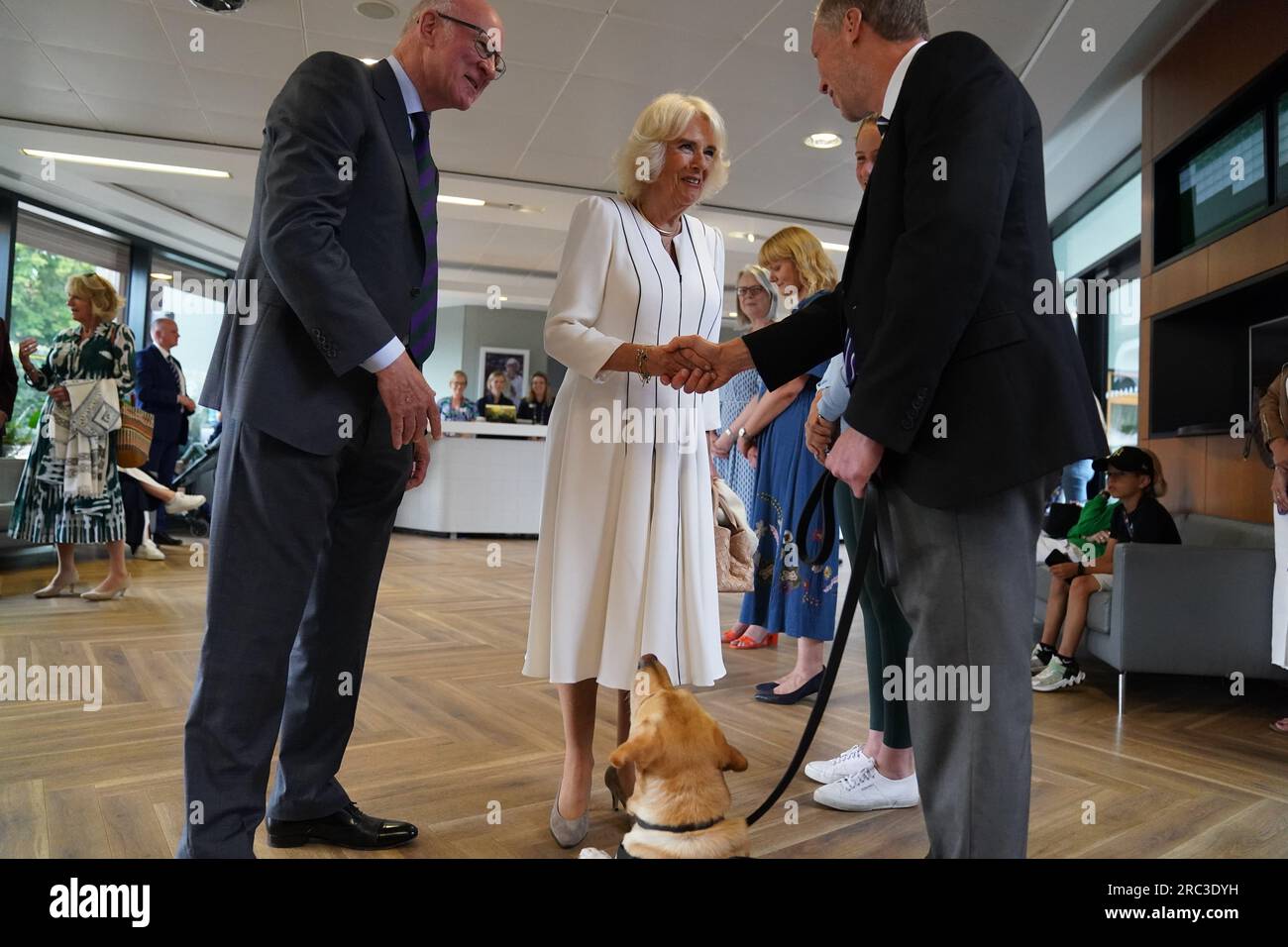 Queen Camilla meeting dog handler Mark Mills and his dog Flo as she ...
