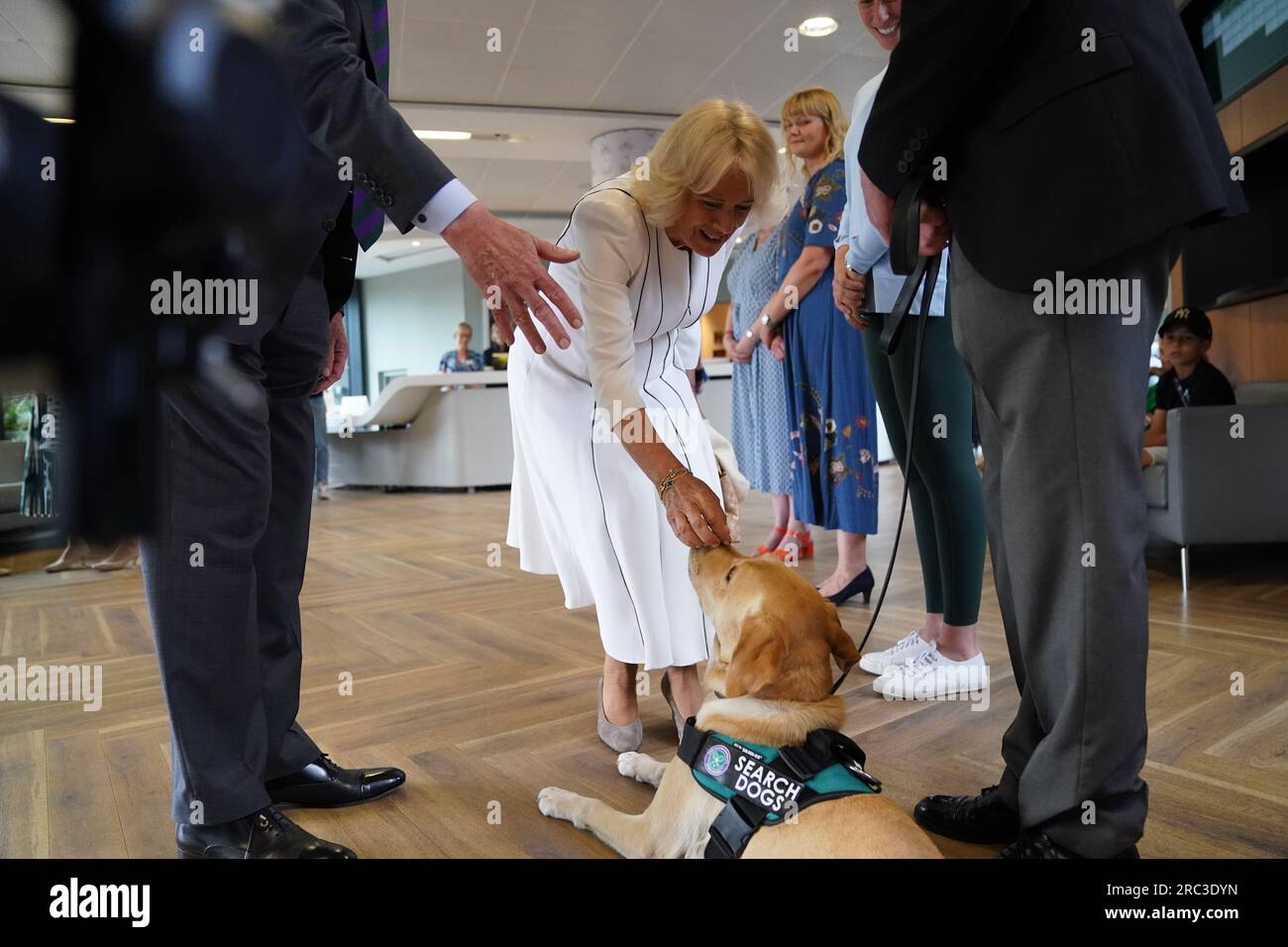Queen Camilla meeting dog handler Mark Mills and his dog Flo as she ...