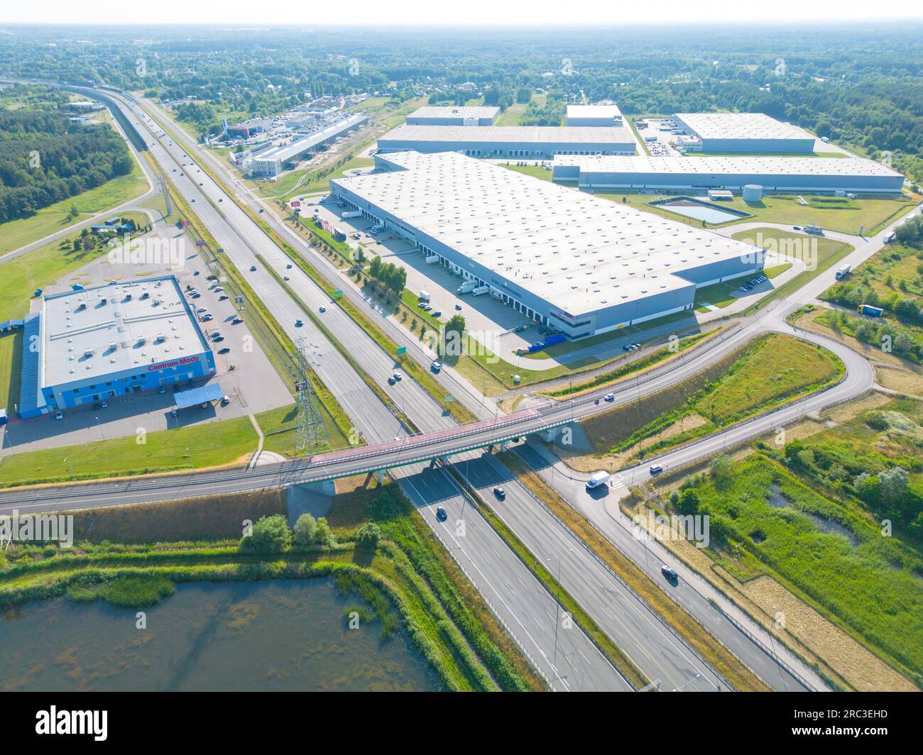 Logistics park with warehouse. Semi-trailers trucks standing on car ...