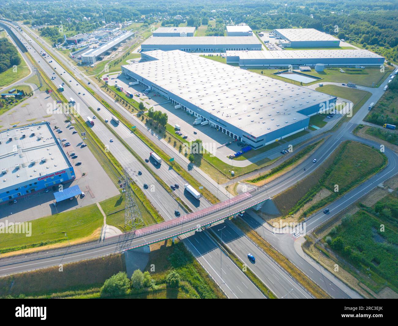 Logistics park with warehouse. Semi-trailers trucks standing on car ...