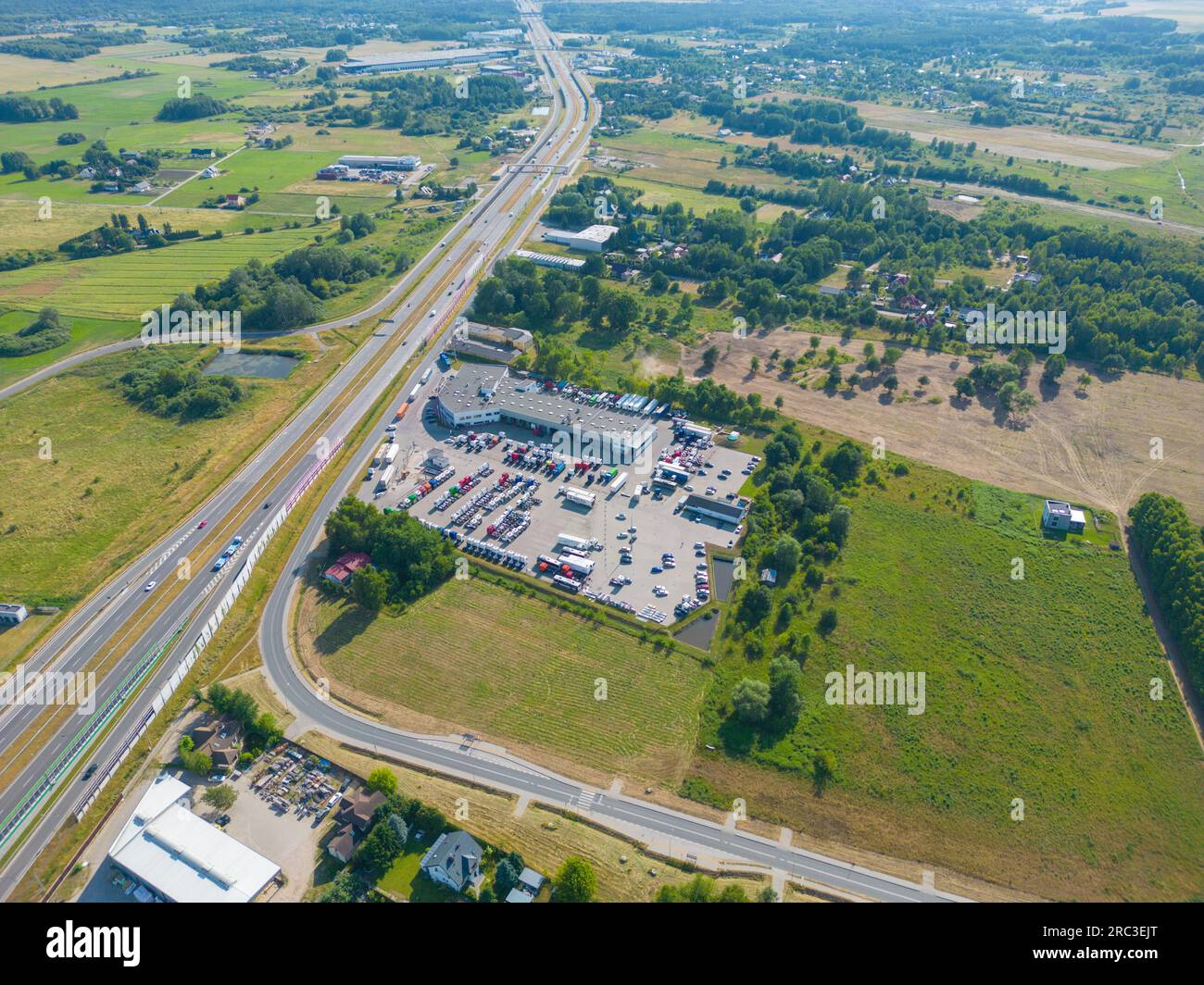 Logistics park with warehouse. Semi-trailers trucks standing on car ...