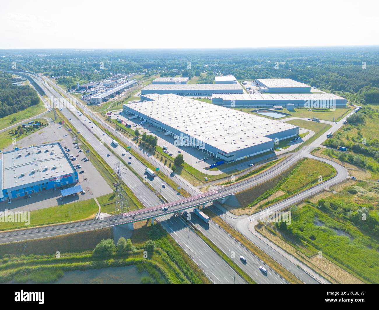 Logistics park with warehouse. Semi-trailers trucks standing on car ...