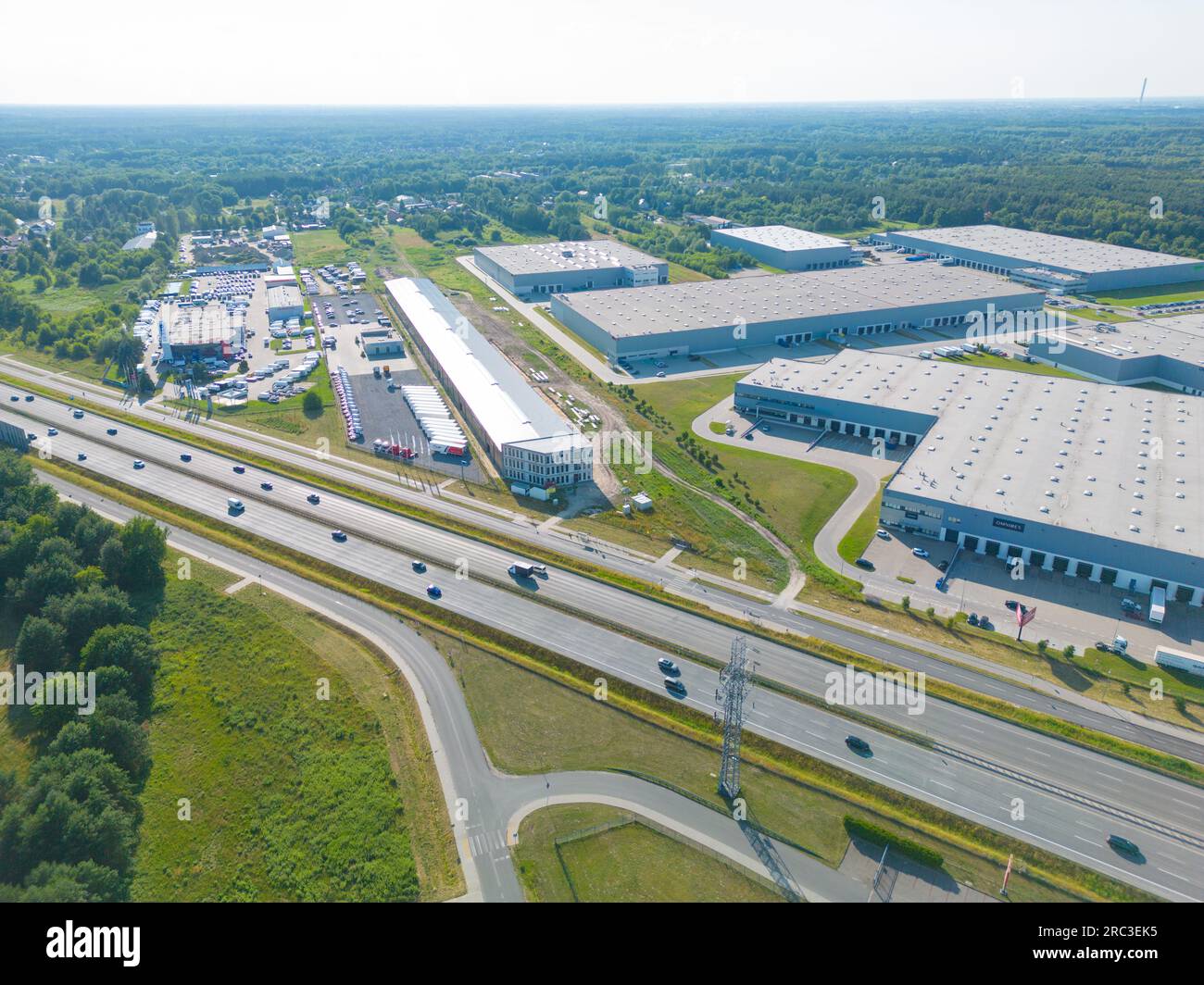 Logistics park with warehouse. Semi-trailers trucks standing on car ...