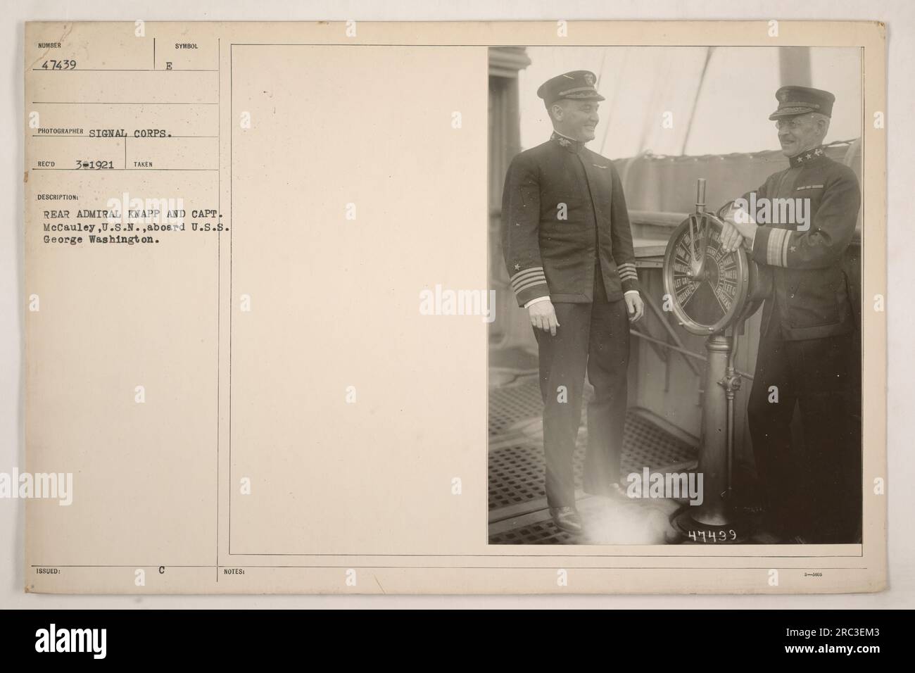 Rear Admiral Knapp and Capt. McCauley of the U.S. Navy are seen aboard ...