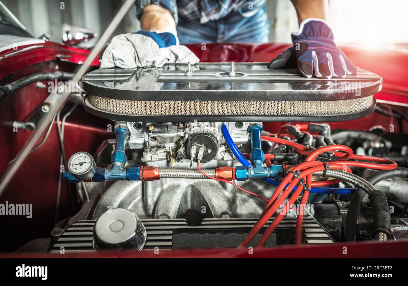 Professional Caucasian Classic Cars Mechanic Taking a Look on a Muscle ...
