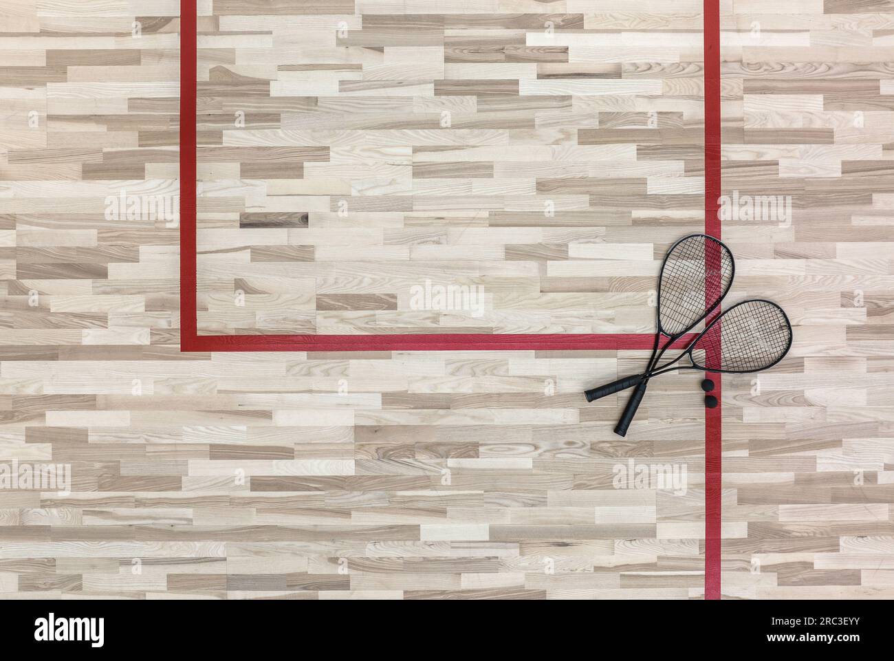 Squash Rackets And a Ball on a Wooden Court Floor. Sport Theme Stock ...