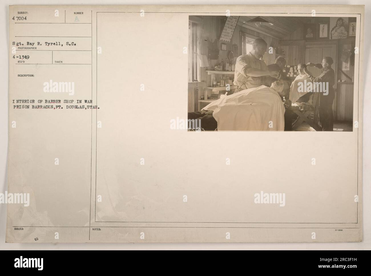 The photograph captures the interior of a barber shop located in the ...