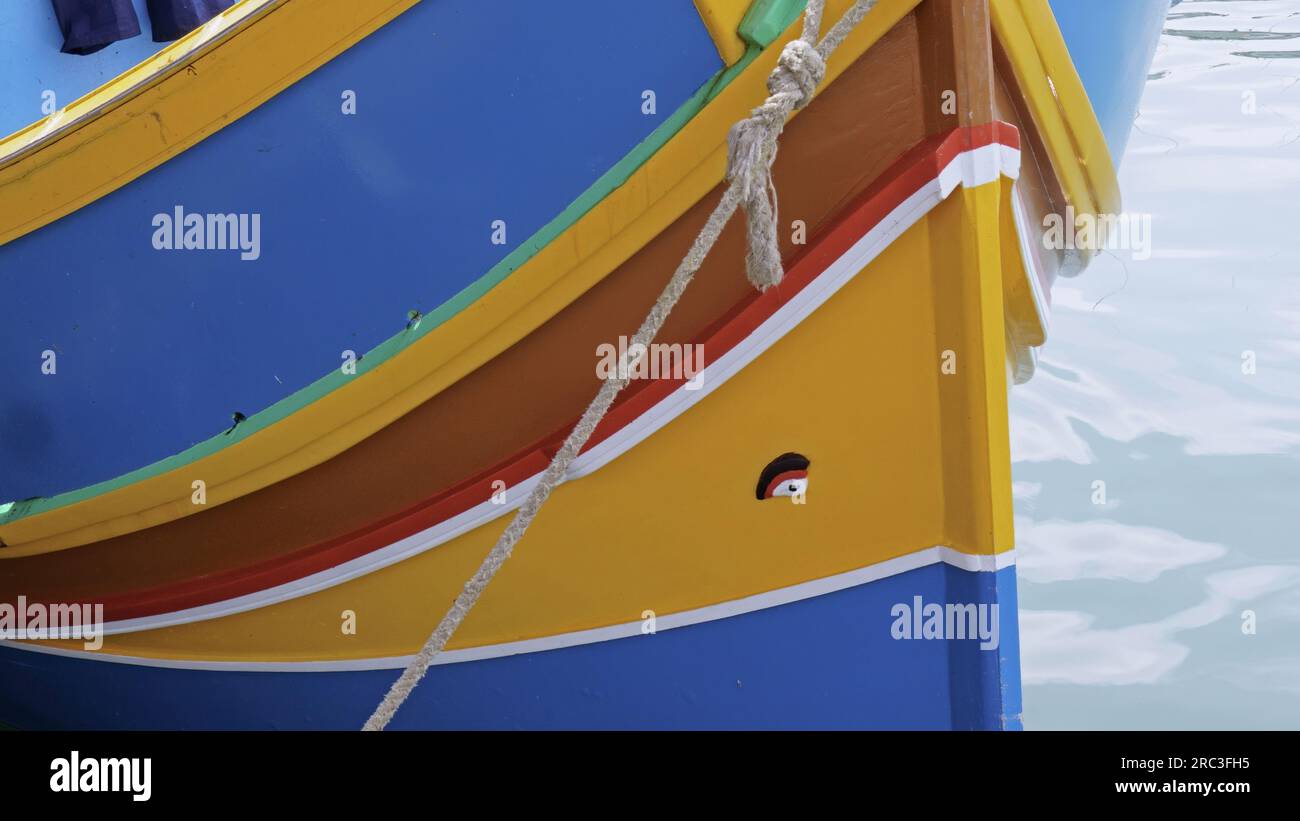 detail of a colorful luzzu, symbol of the island of Malta, with the ...