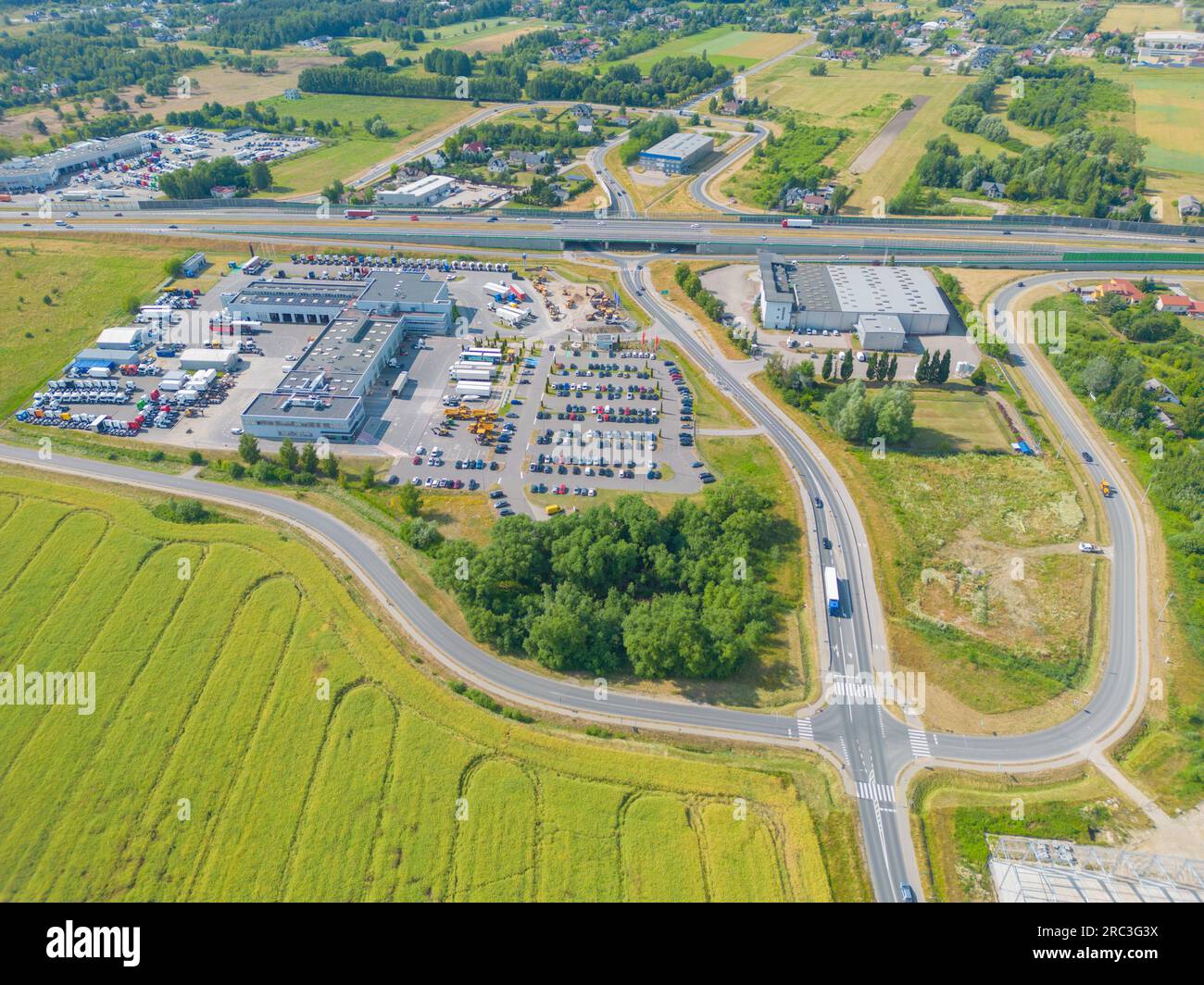 Aerial view of storage and freight terminal with trucks and containers ...