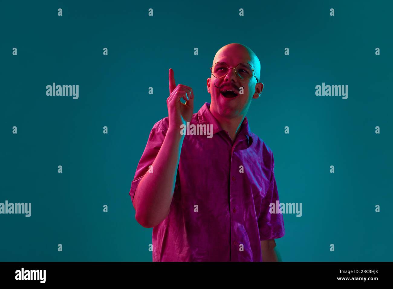 Portrait of young bald man with moustache and trendy unglasses ...