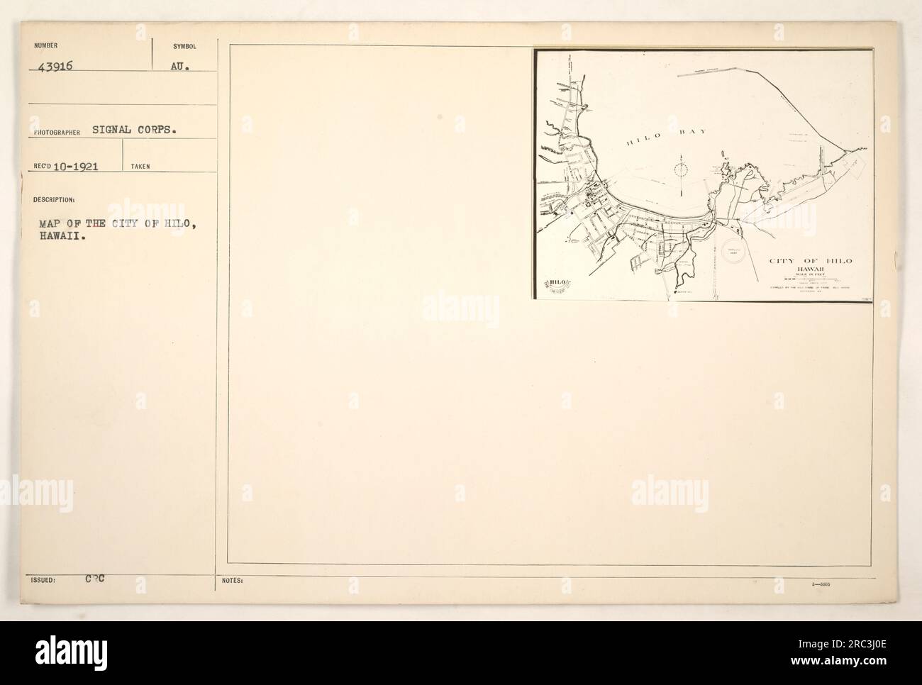 Soldiers stationed in Hilo, Hawaii studying a map of the city. The ...