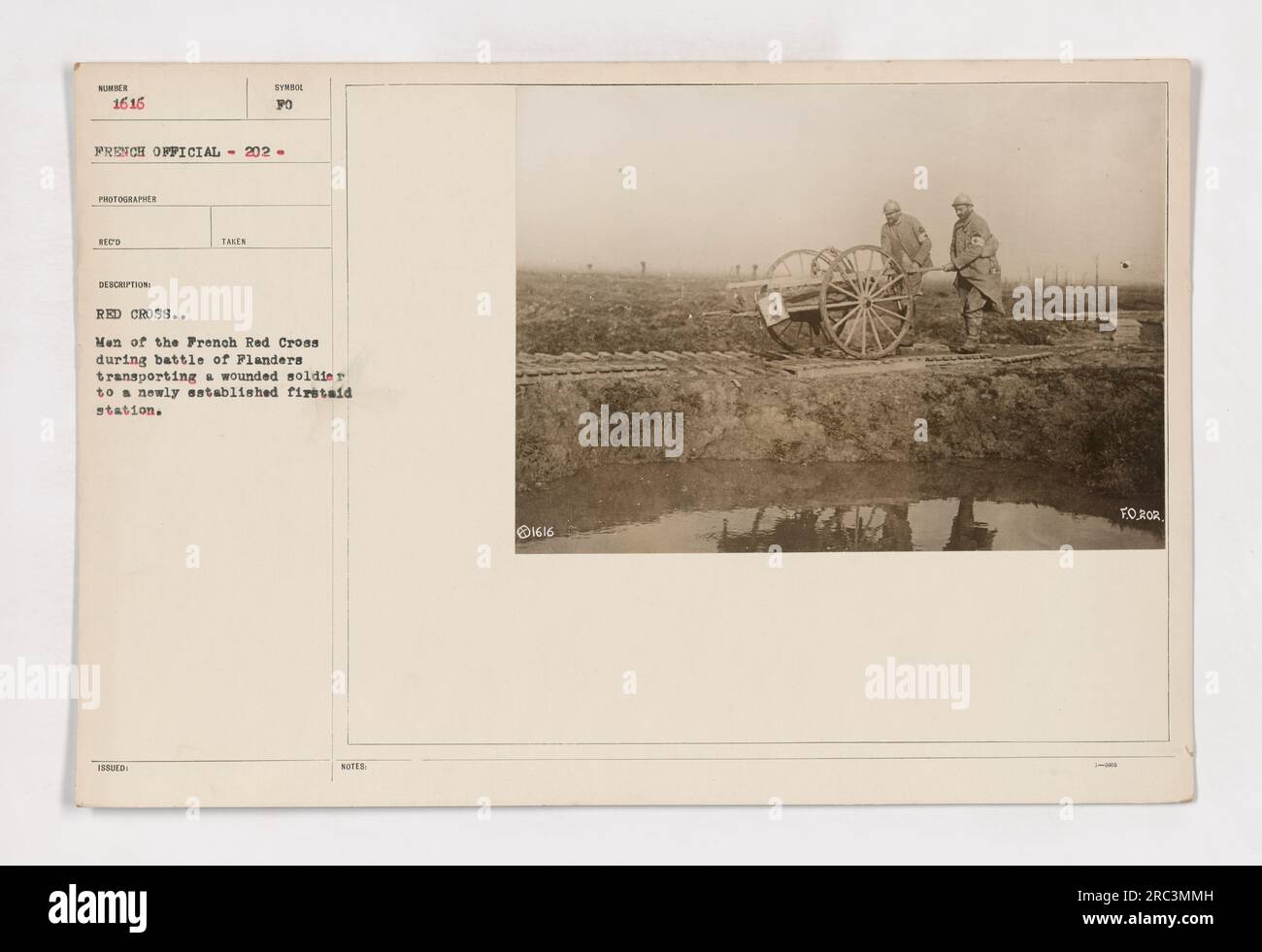 Men of the French Red Cross transporting a wounded soldier to a first ...