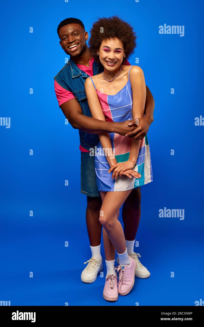 Full length of smiling african american man in bright summer outfit ...
