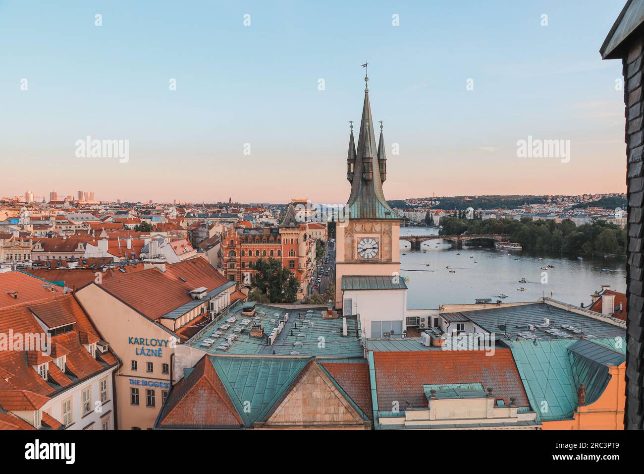 Old Town of Prague under the warm rays of the setting sun illuminating ...