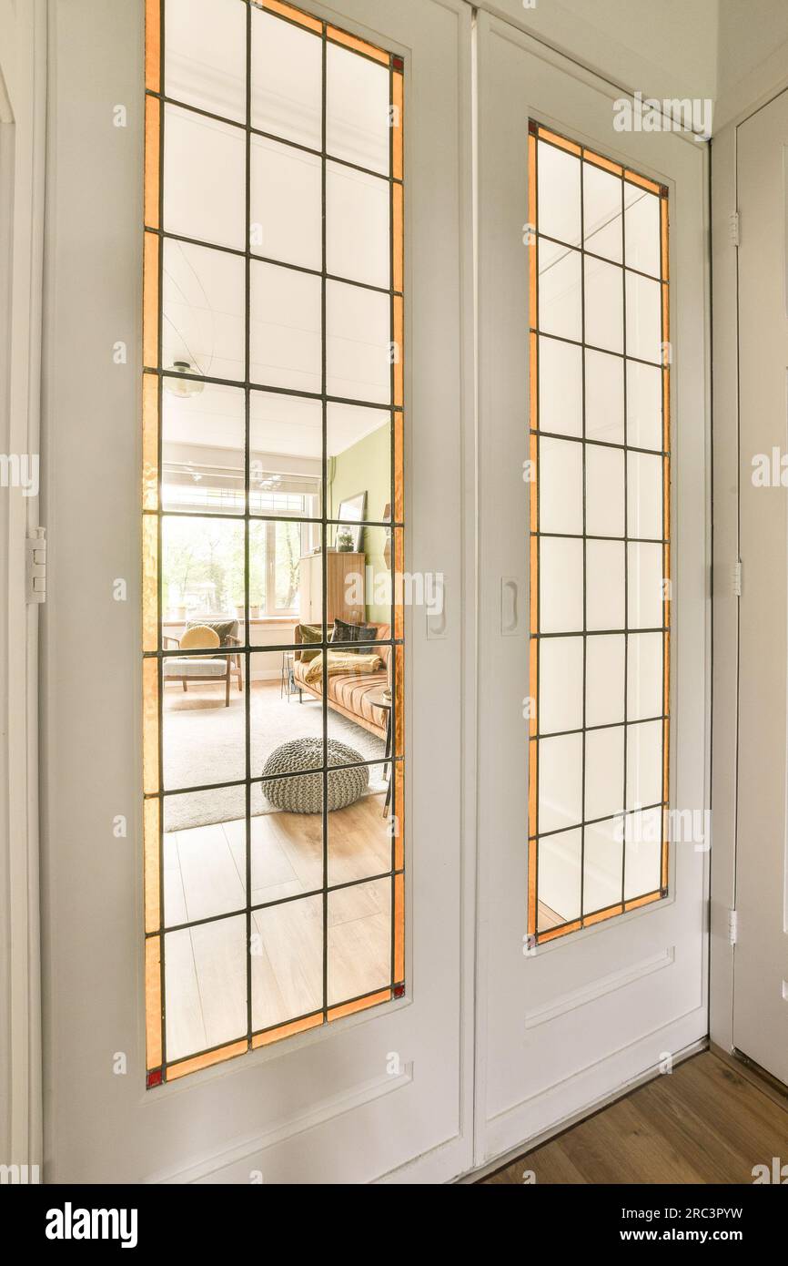 the inside of a house with two doors that are open and there is an ...