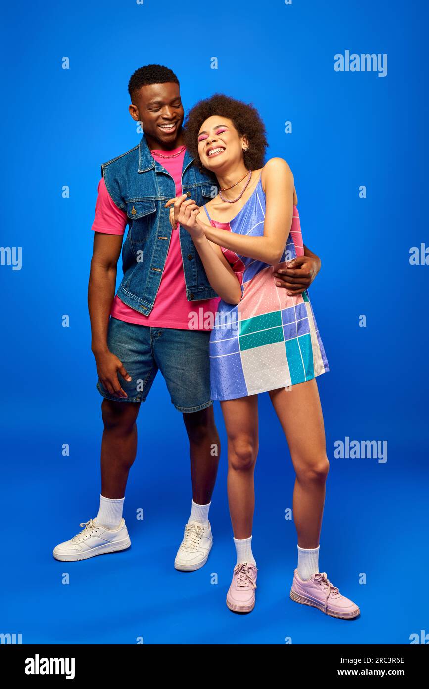 Full length of cheerful and stylish young african american man in denim ...