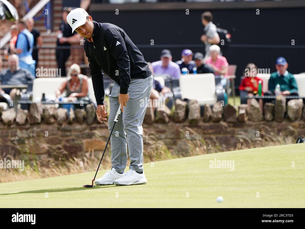 Xander Schauffele putts on the 18th green during the Pro-Am ahead of ...