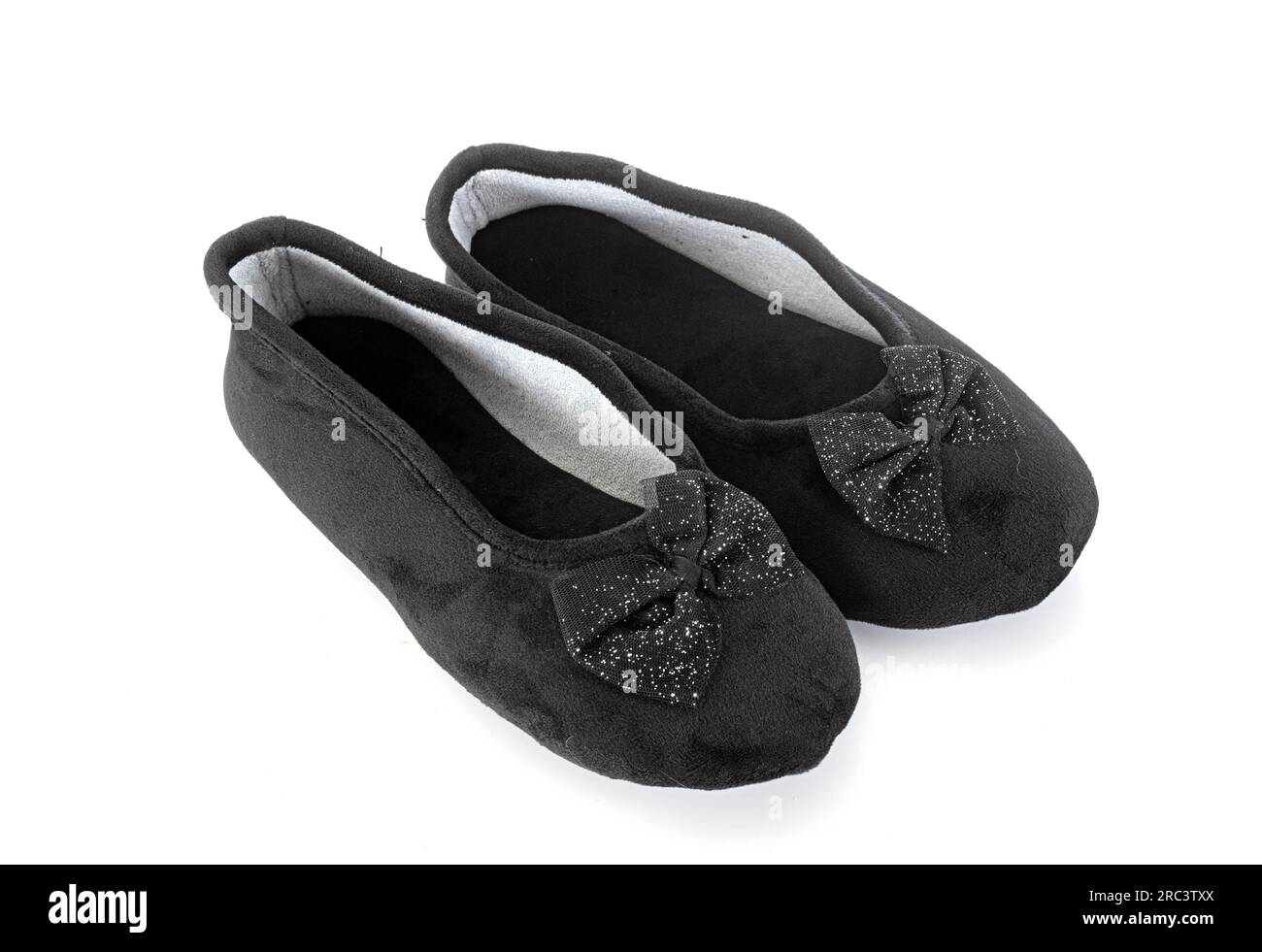 black velvet slippers in front of white background Stock Photo - Alamy