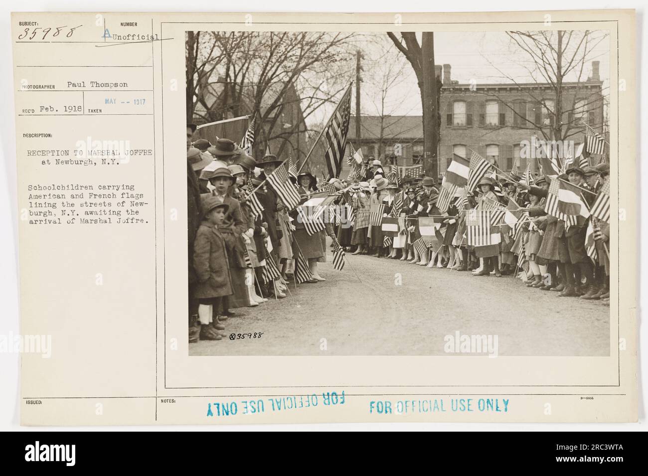 School children in Newburgh, NY line the streets carrying American and ...
