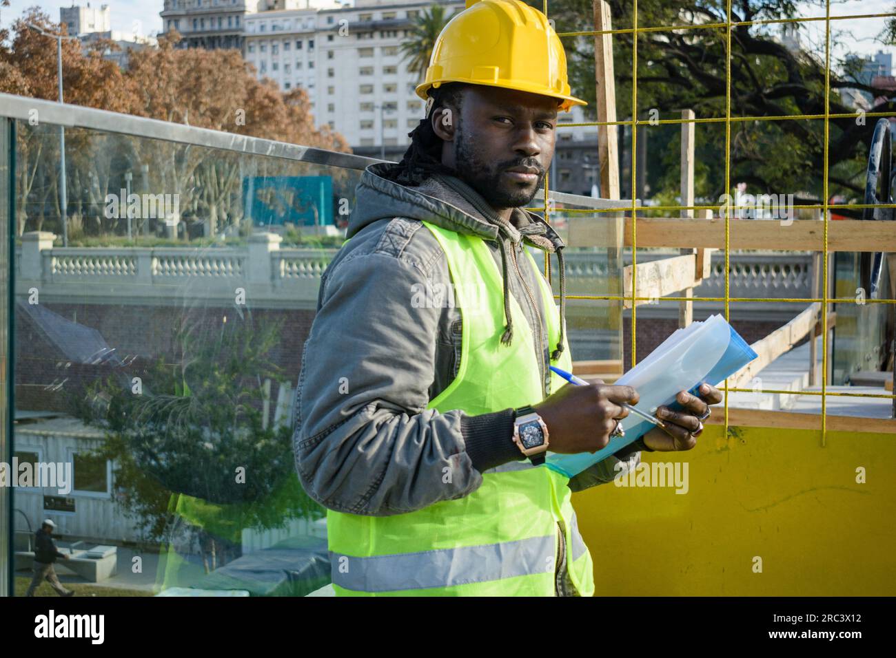 civil engineer man of African ethnicity with a beard and dreadlocks ...