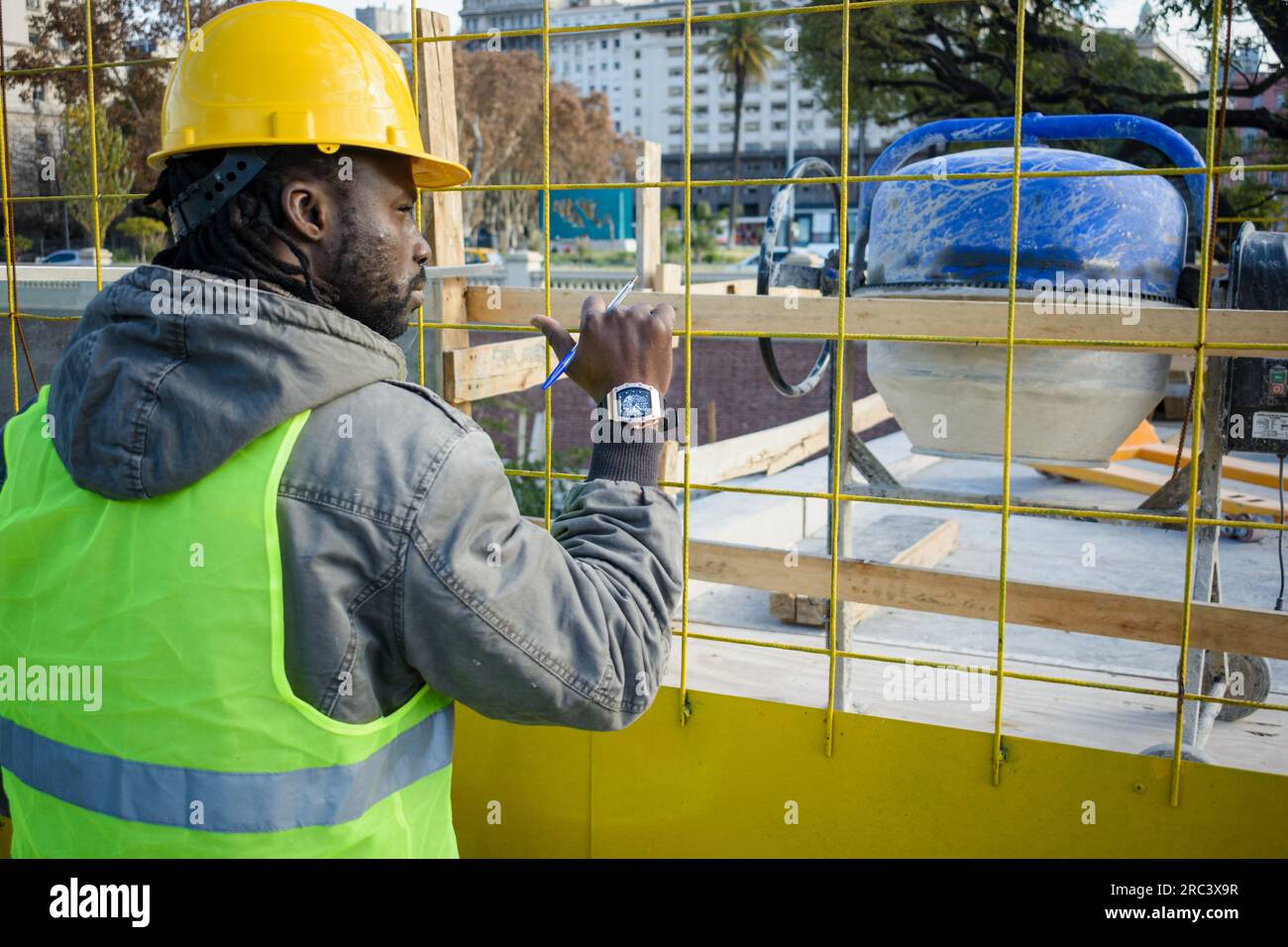 young black man civil engineer wearing yellow safety helmet, standing ...